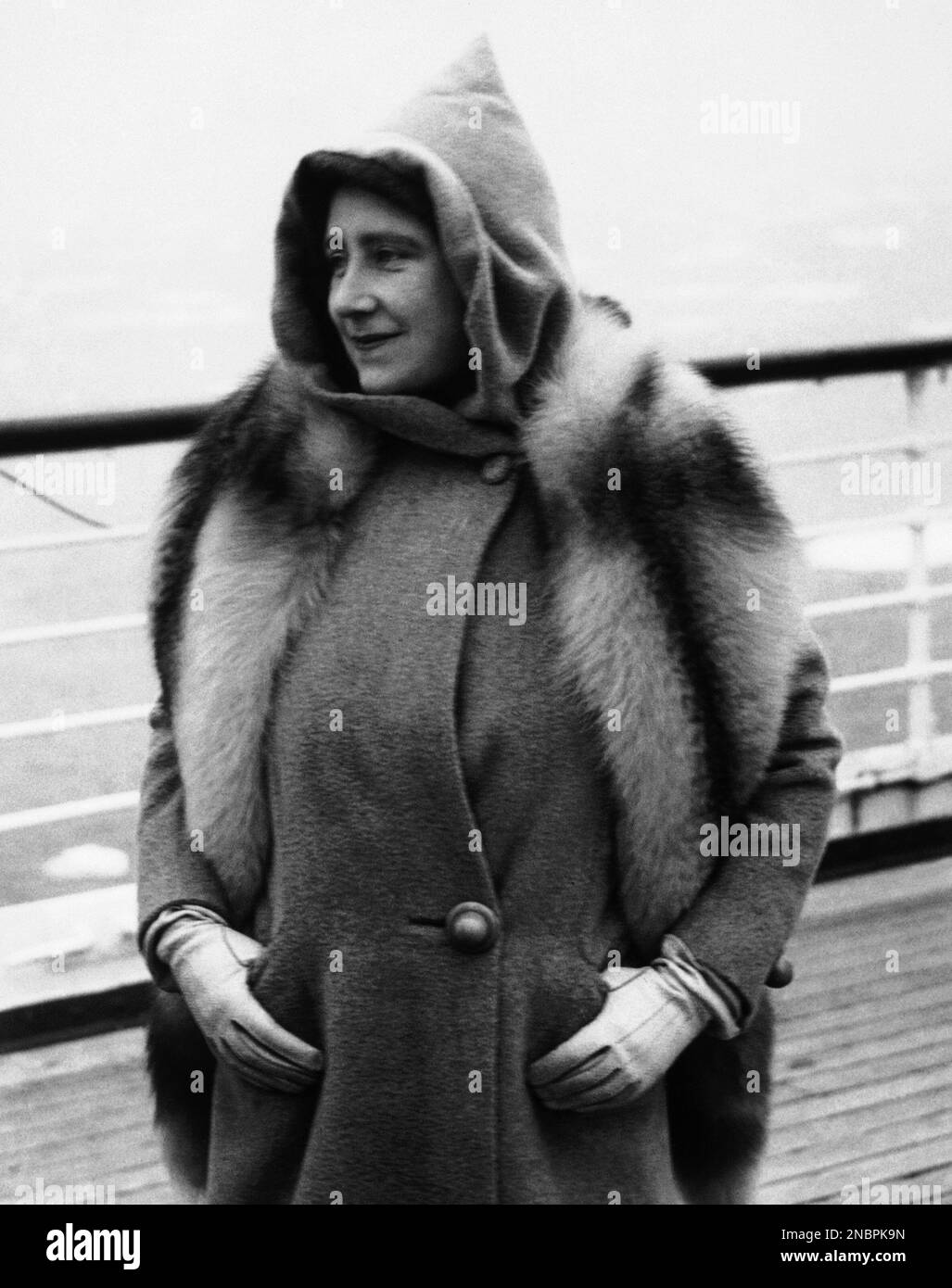 Dressed in heavy clothing and with an Eskimo type of head covering ...