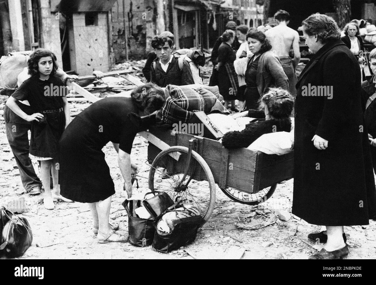 French civilians return to their homes in Falaise on August 23, 1944 ...