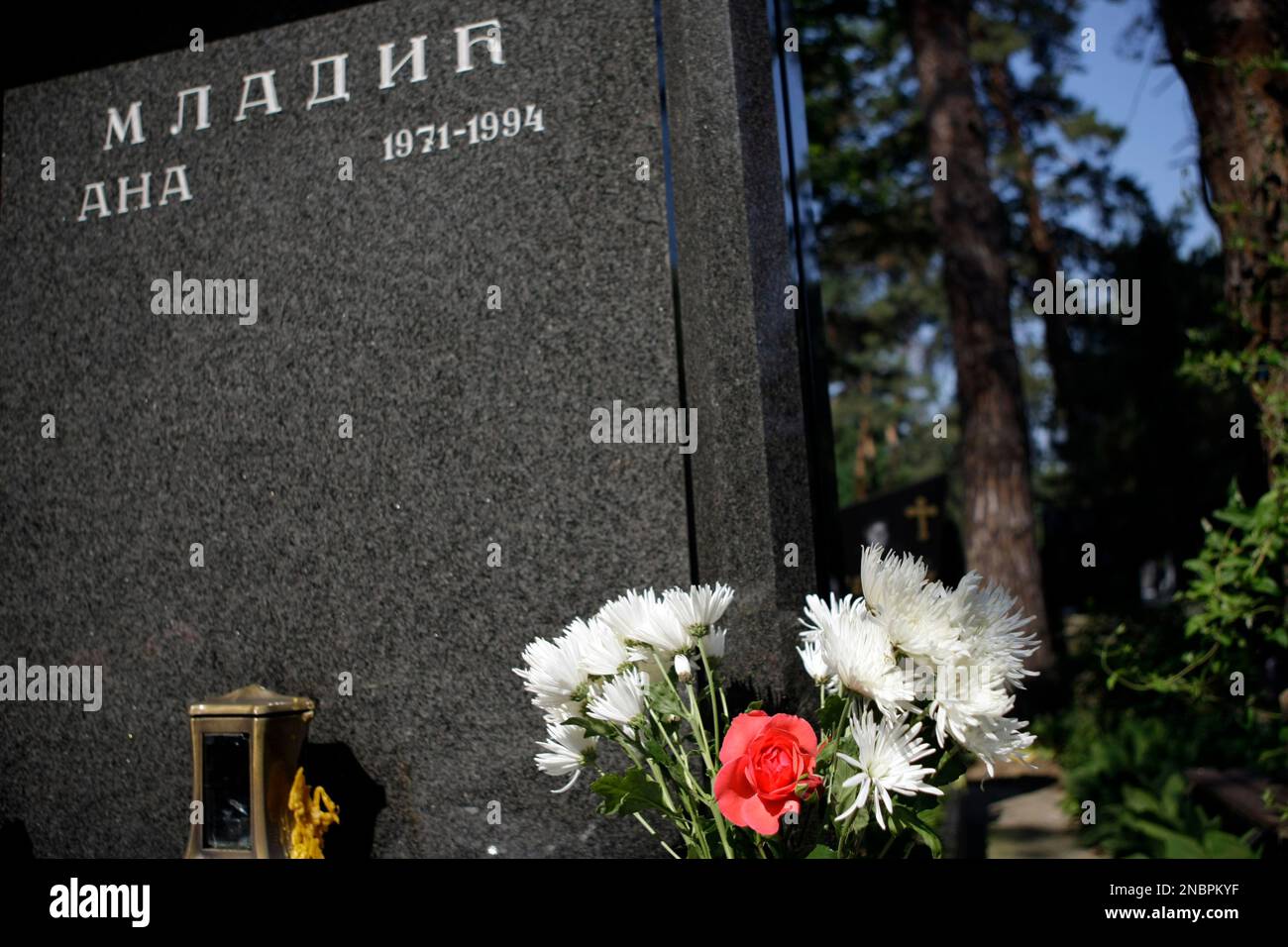 A white bouquet of flowers and a red rose laid by Ratko Mladic, jailed ...