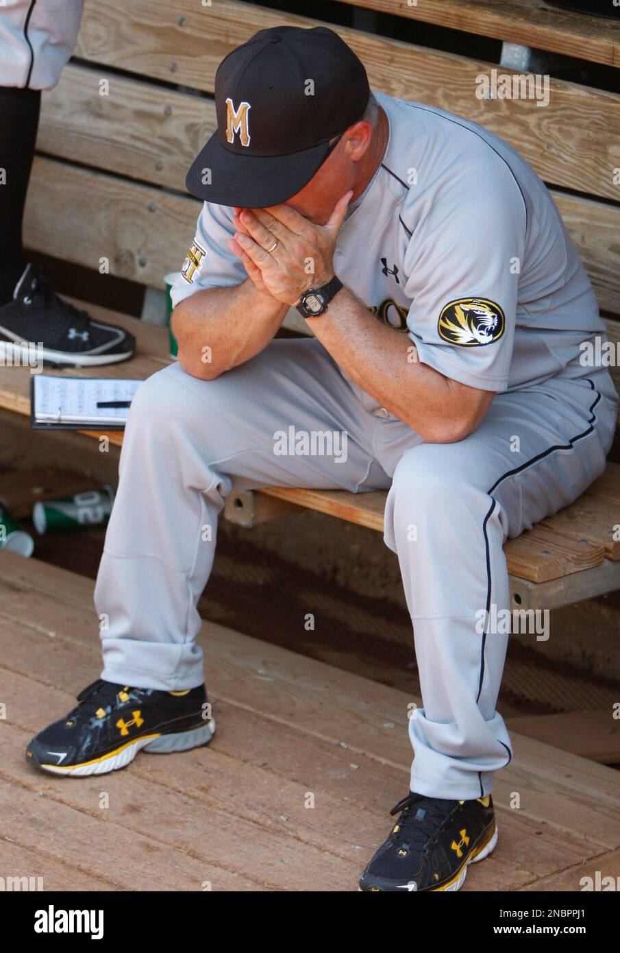 Missouri head coach Tim Jamieson sits the dugout following a 10-9 loss to Texas A&M in the Big ...