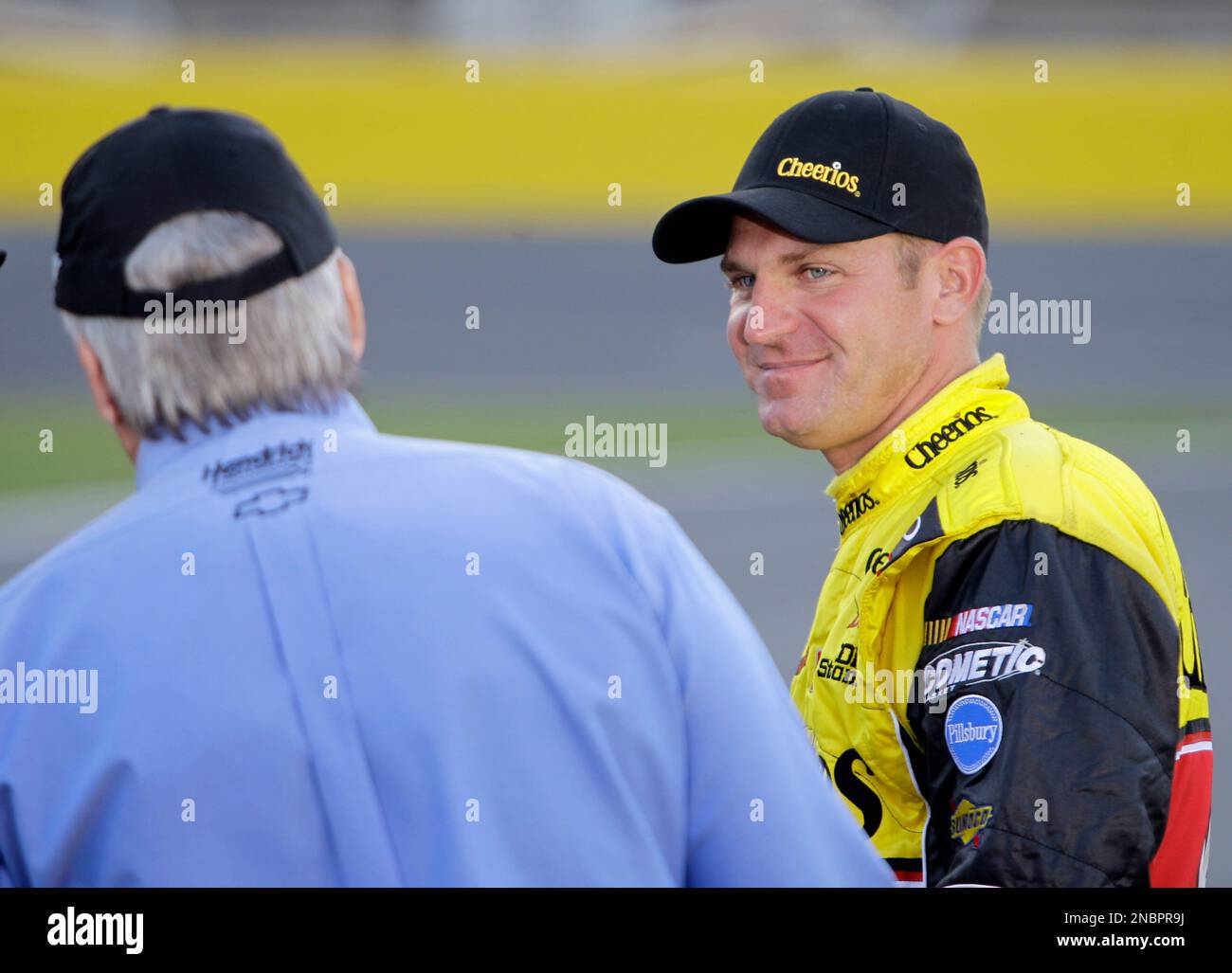 Clint Bowyer, right, waits before qualifying for Sunday's NASCAR Sprint ...