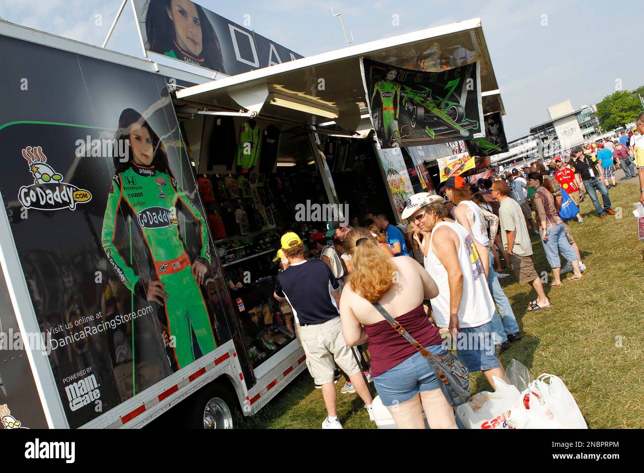 Race fans check out Danica Patrick merchandise at a trailer during the ...