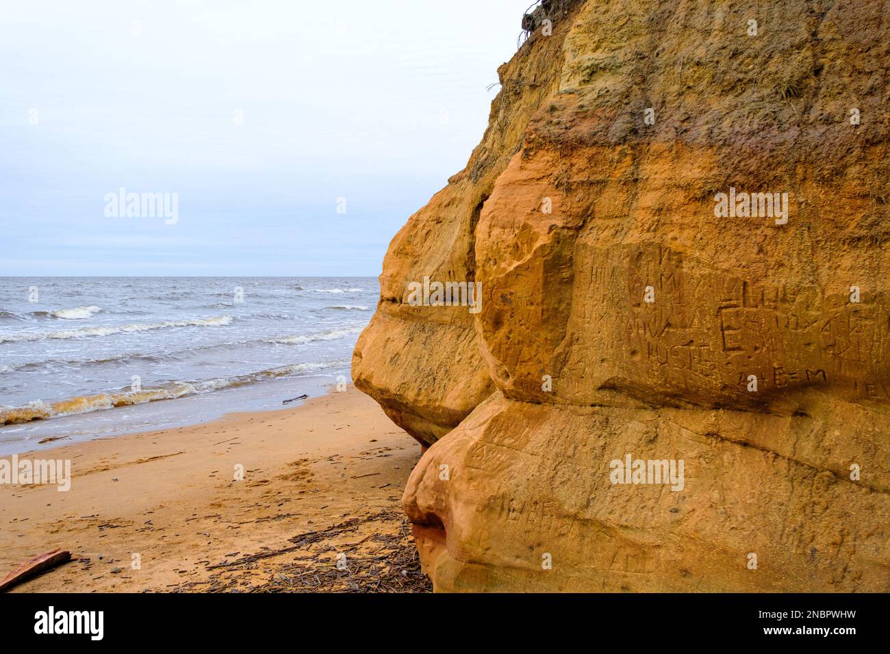 Beautiful in any weather, colorful sandstone cliffs. Beautiful coast of ...