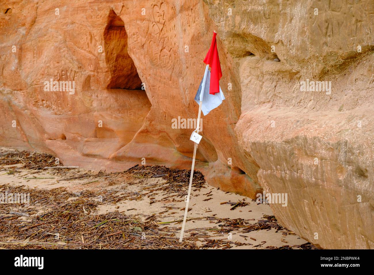 Beautiful in all weathers, colorful sandstone cliffs with fishing flags ...