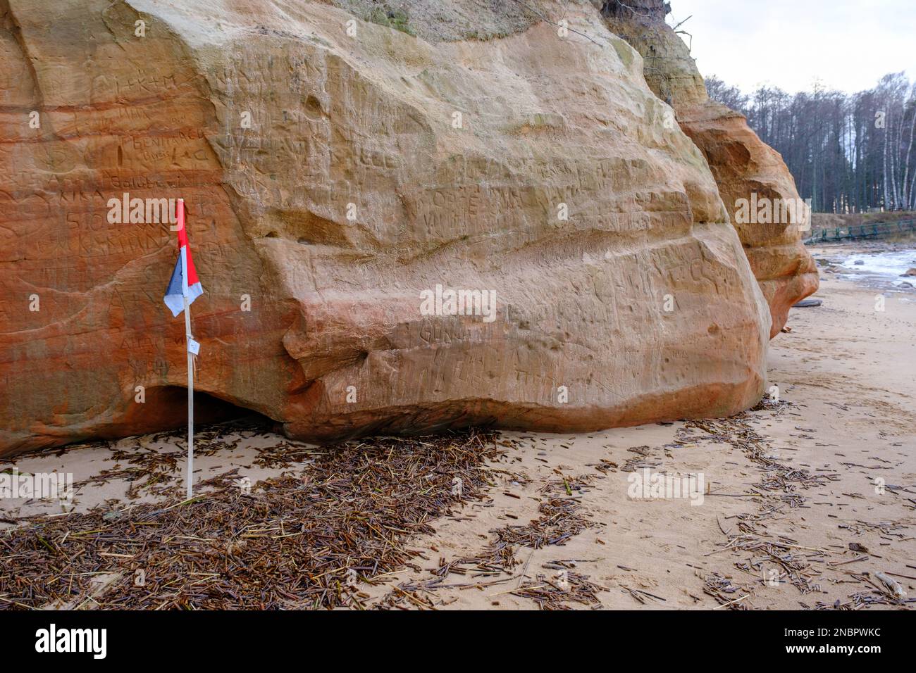 Beautiful in all weathers, colorful sandstone cliffs with fishing flags ...