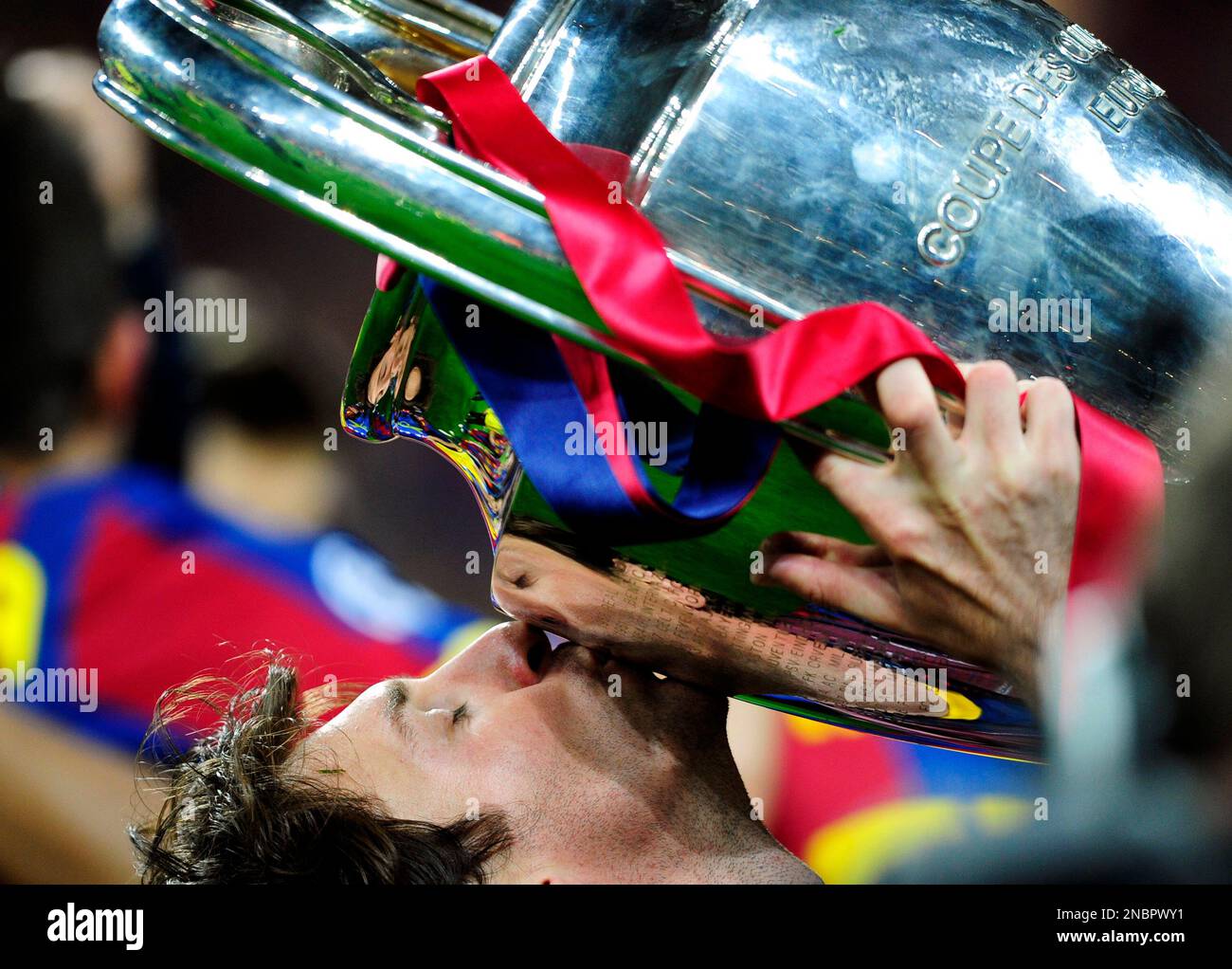 Barcelona's Lionel Messi celebrates with the trophy after winning the ...