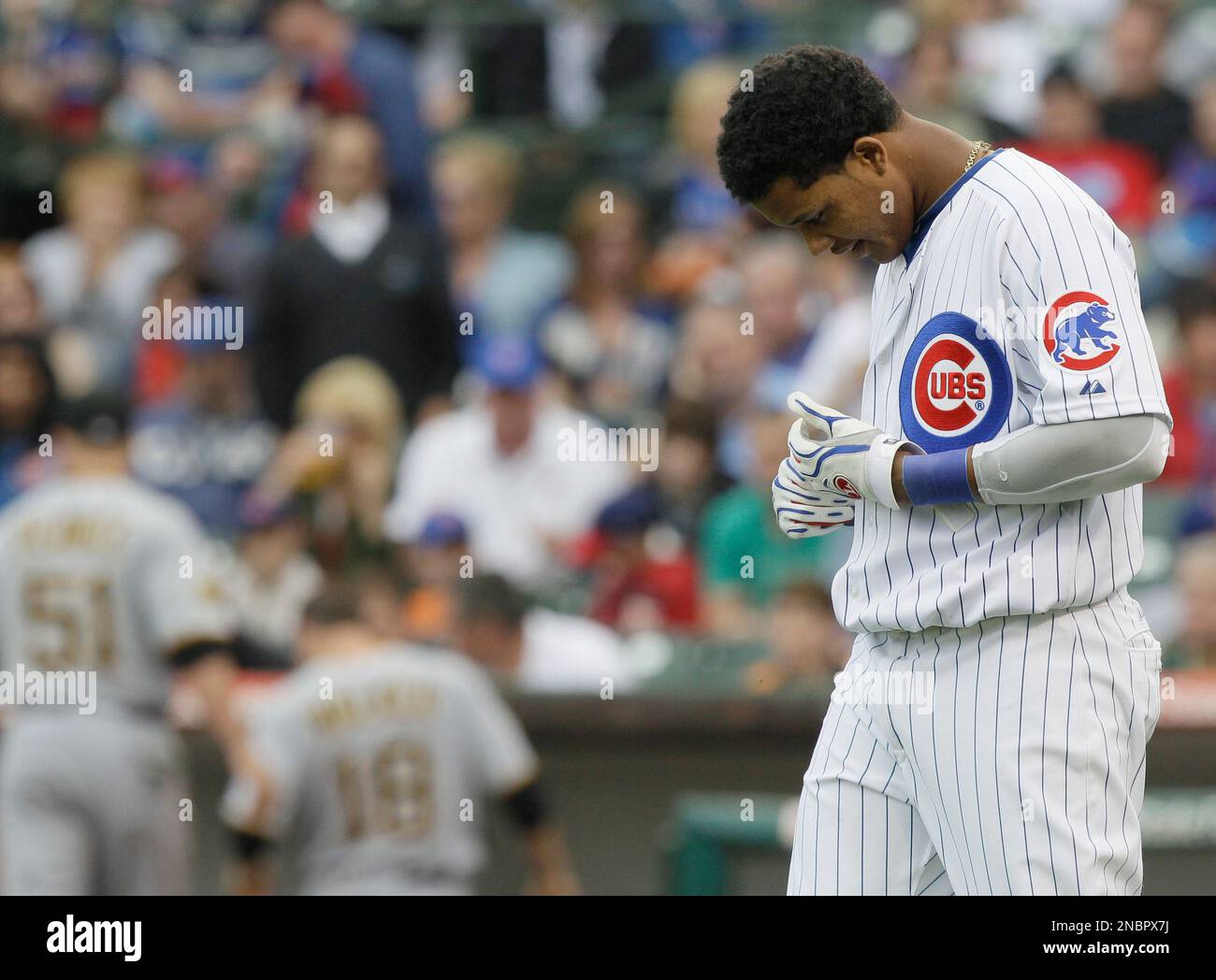 Chicago Cubs' Starlin Castro looks down as he walks off the field after ...