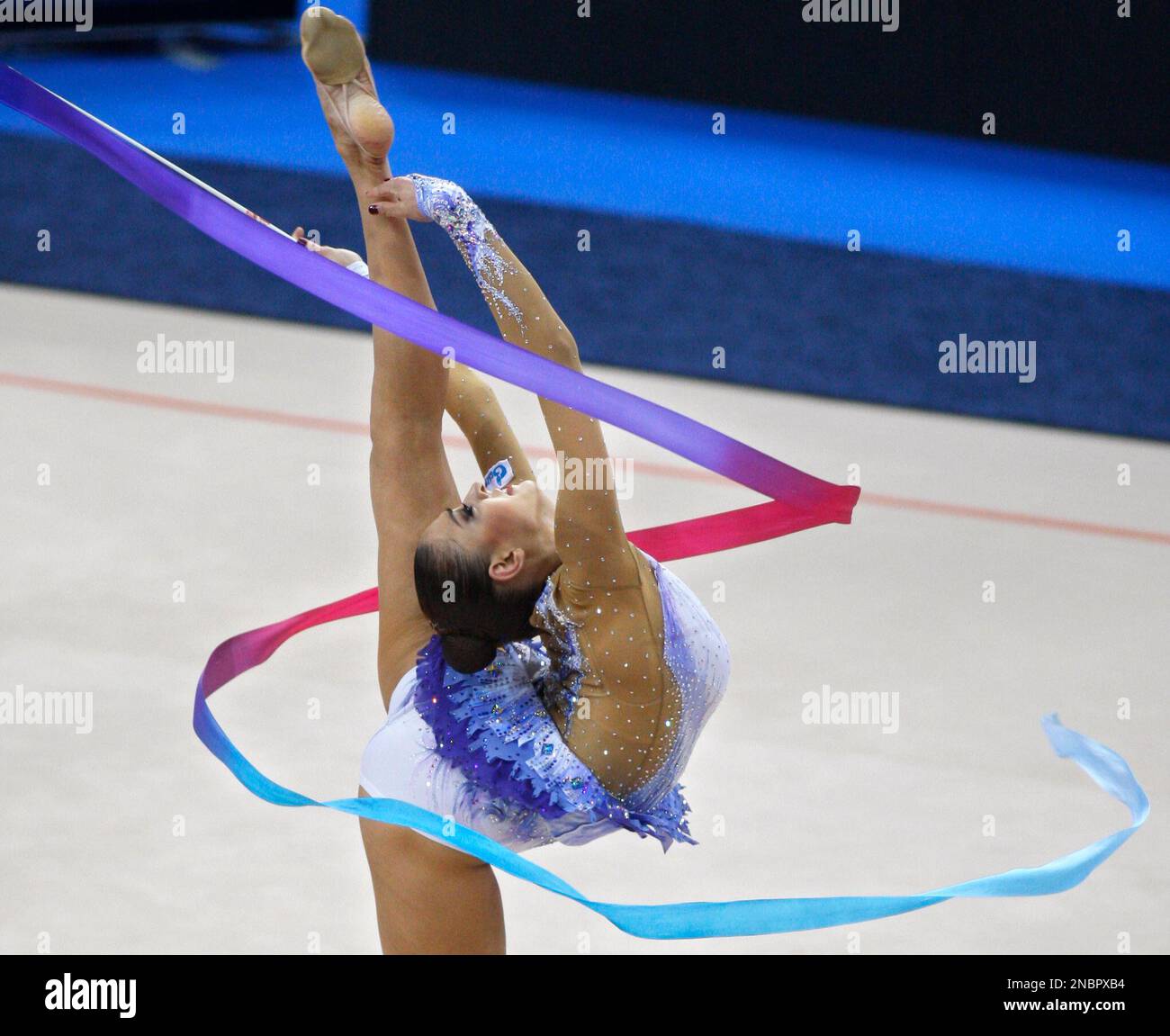 Evgenia Kanaeva, of Russia, performs with a ribbon during her apparatus ...