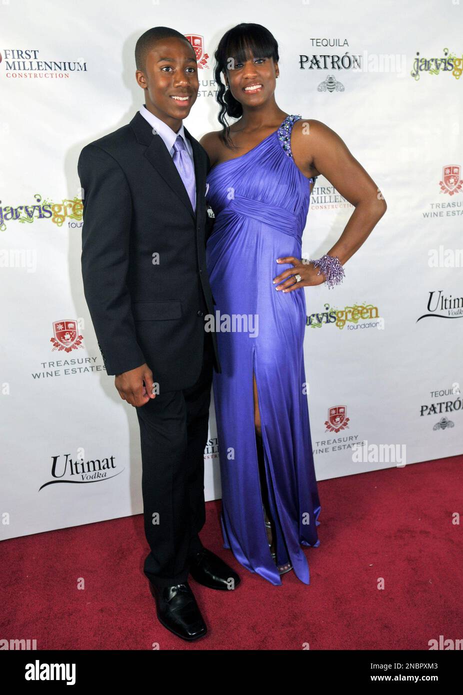 From left, Terrence Green and mother Kia Green have their photo taken ...