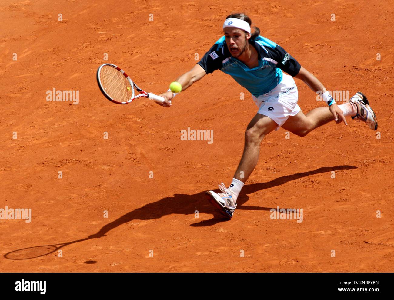 Croatia's Antonio Veic returns the ball to defending champion Spain's ...