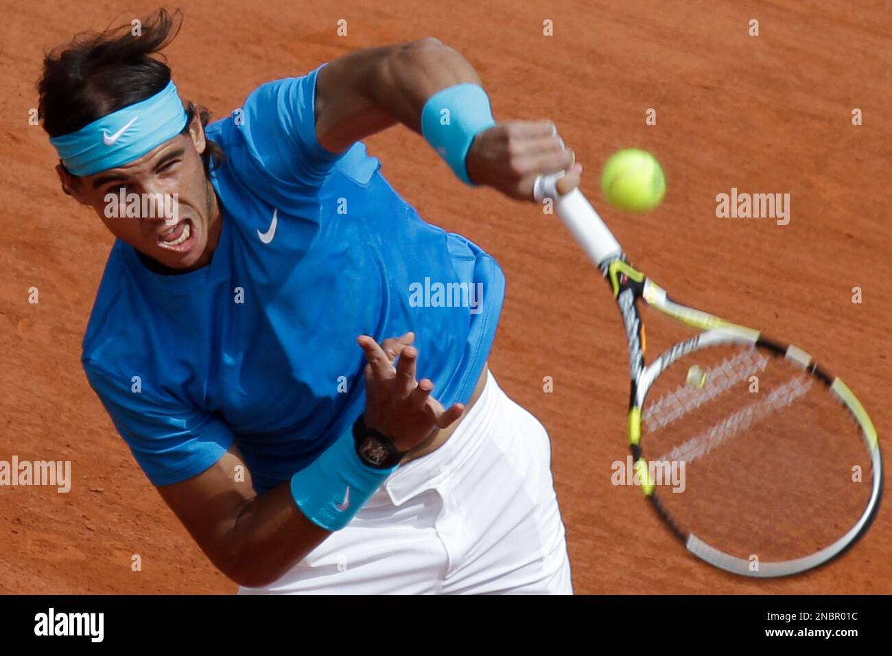 Rafael Nadal of Spain serves against Antonio Veic of Croatia in his ...