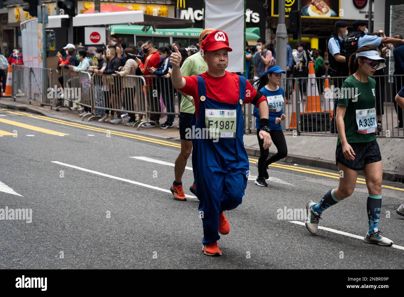 A runner dresses as the cartoon character Mario of Super Mario attends ...