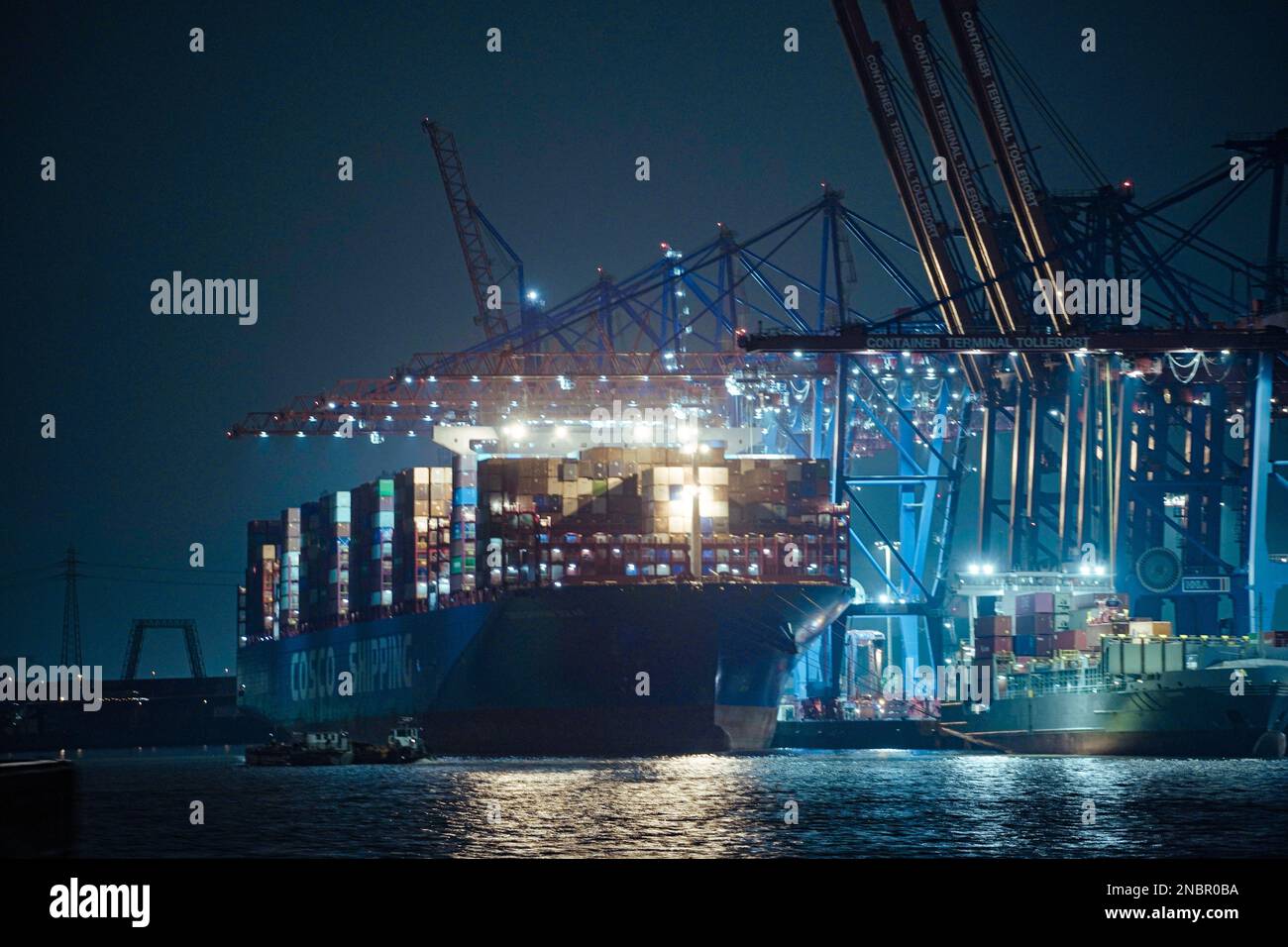 Europe, Germany, Hamburg, Hamburg at night - container vessel in port ...
