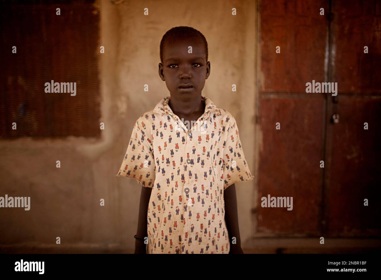 An extended family member of Martha Abiem Deng poses for a portrait in ...