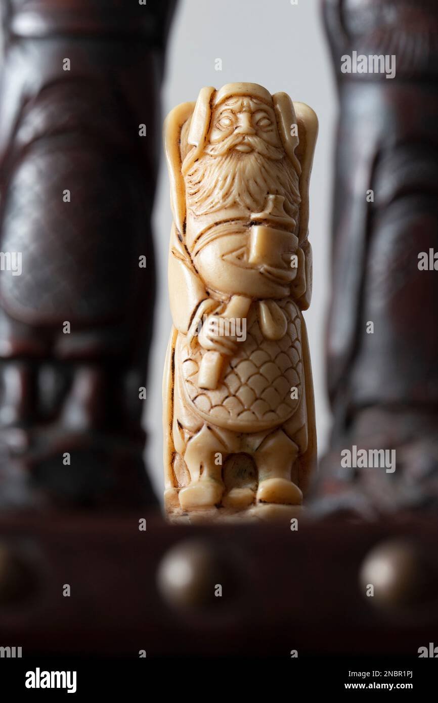Chinese oriental chess pieces, with the white king emperor between two ...