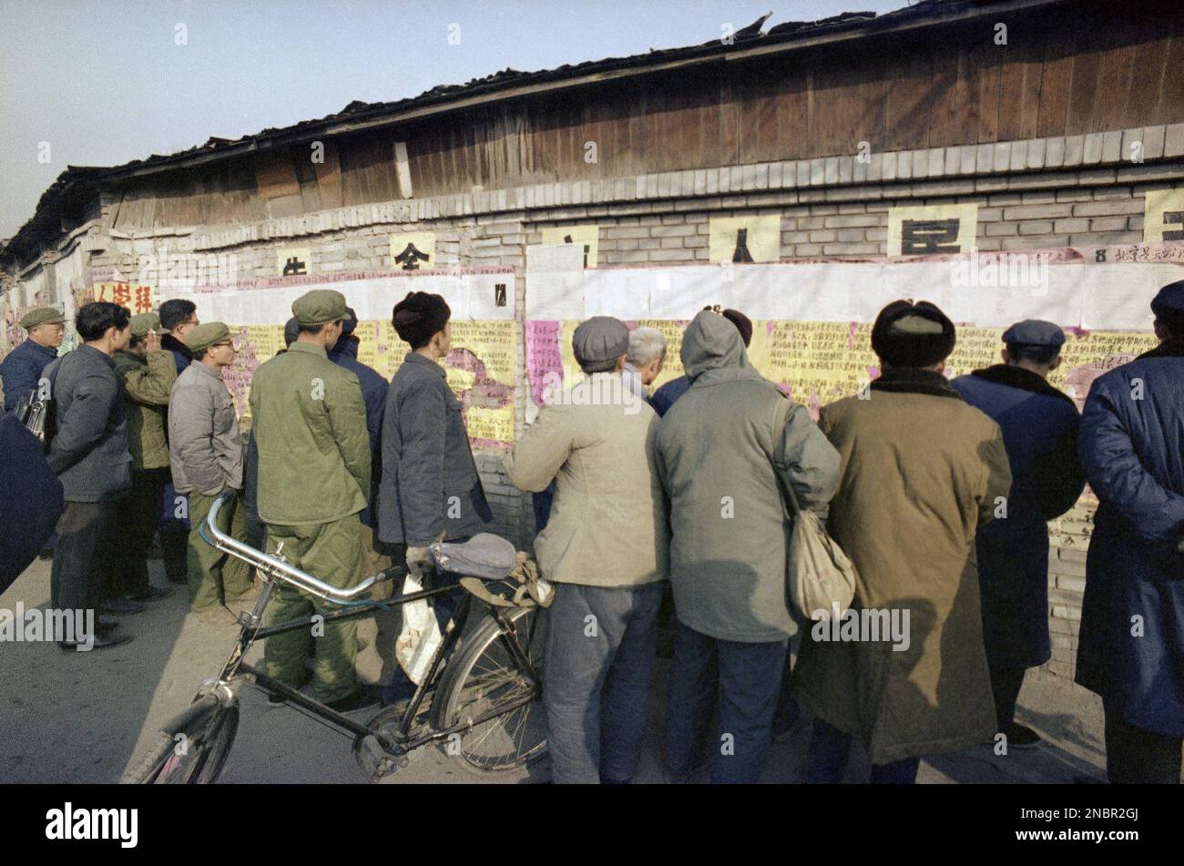 Chinese people gather in front of the Democracy Wall to read posters in ...