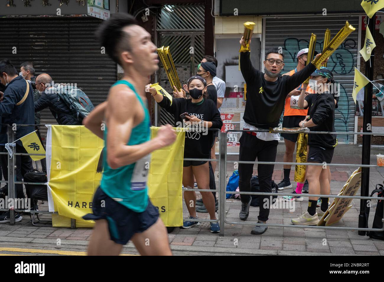 Citizens seen carrying thunder sticks to cheer for the runners passing ...