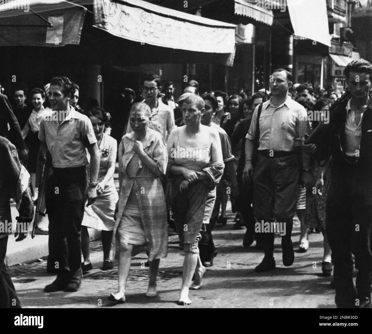 Two Paris women collaborators, partially stripped and their hair ...