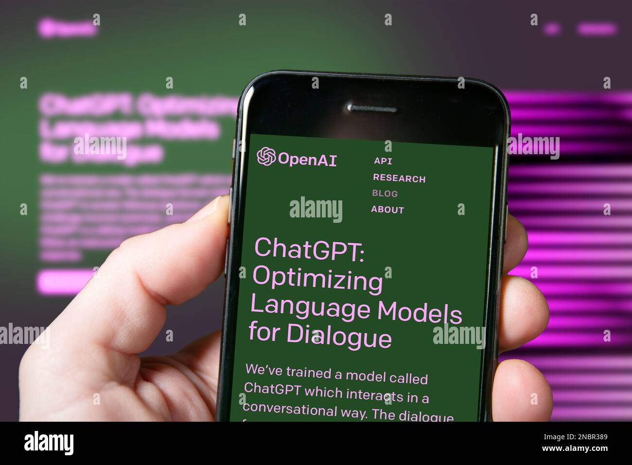 Screen of a smartphone with ChatGPT chat, AI tool, artificial intelligence. Man using ChatGPT ...