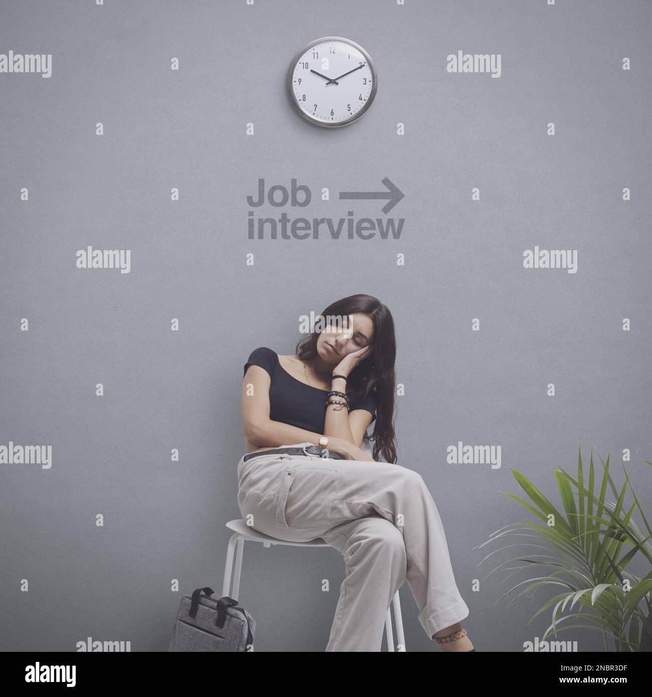 Young bored student sitting on a chair and waiting for a job interview ...