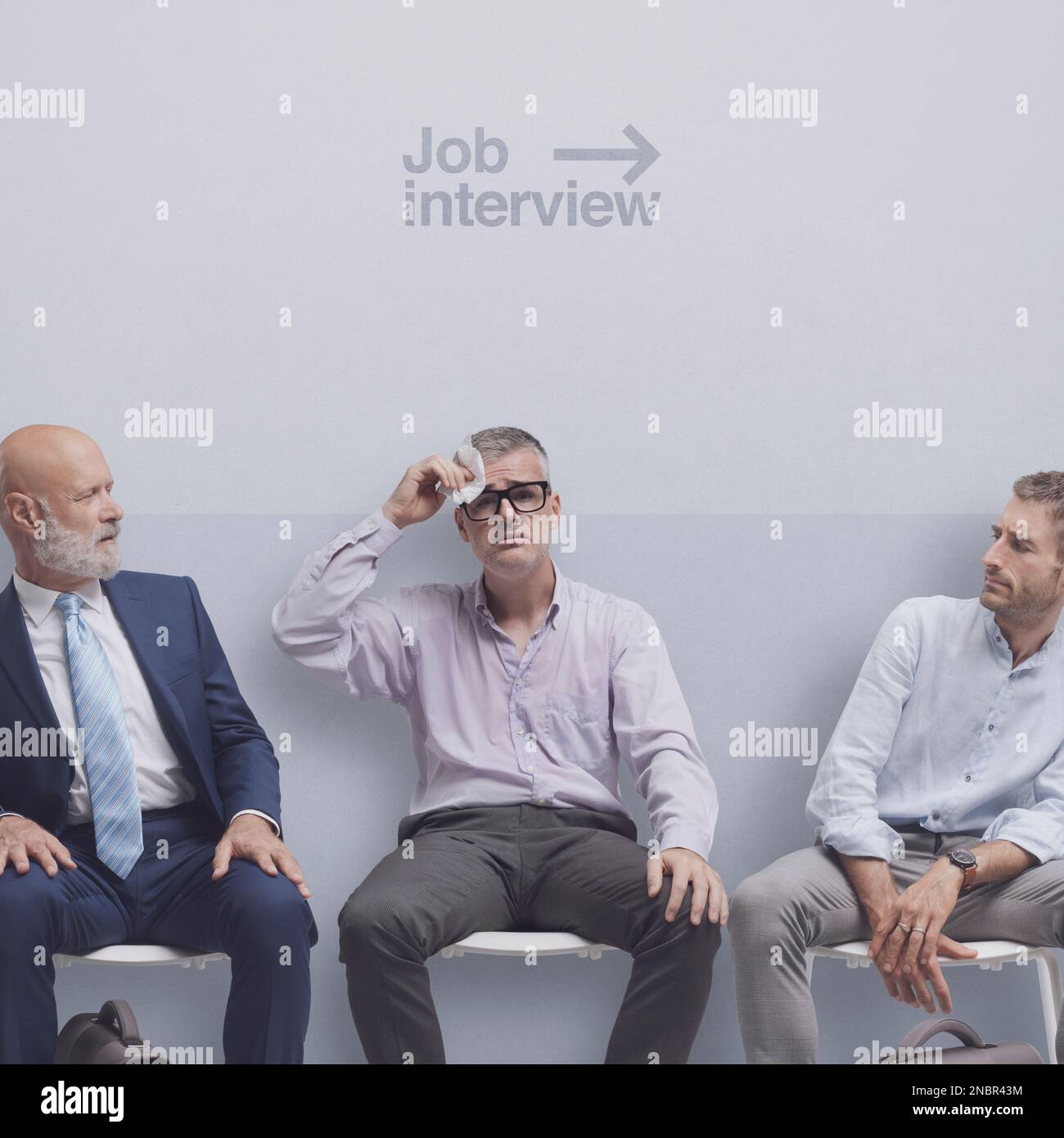 Anxious scared man sitting and waiting for a job interview, he is ...