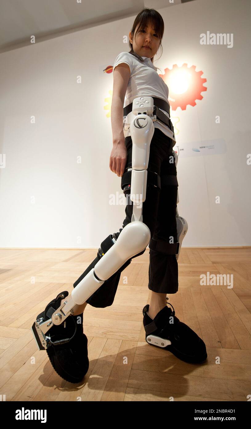 A woman wears the Robot Suit HAL made by Japanese Cyberdyne company at ...