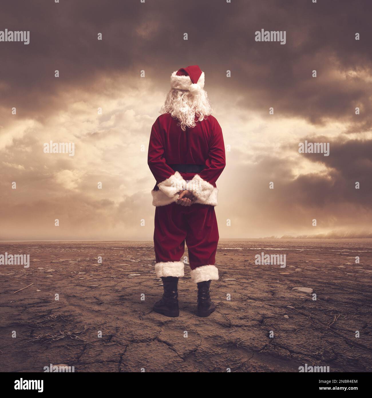 Hopeless lonely Santa Claus staring at the barren polluted land in ...