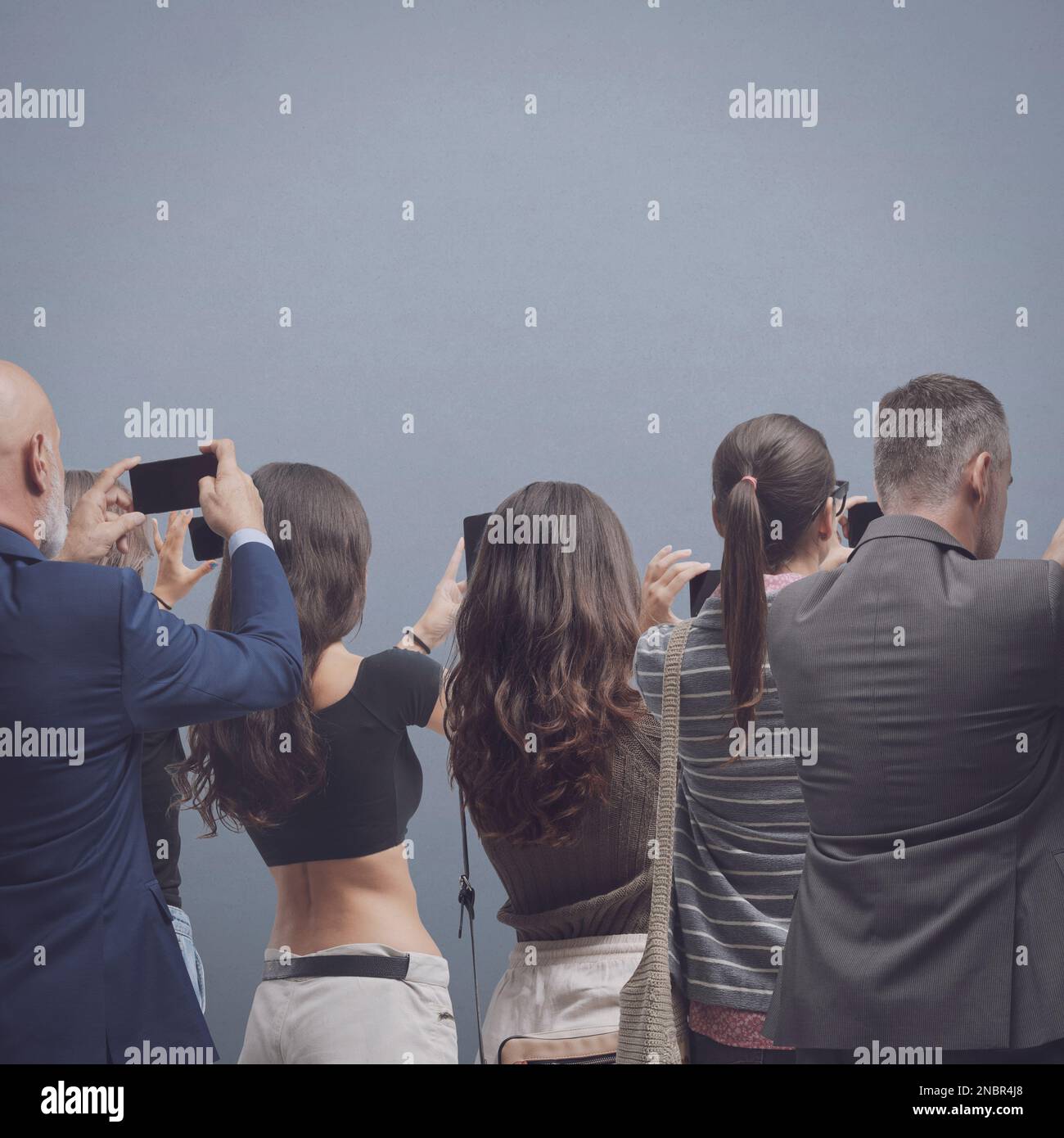 Women taking pictures with mobile phones hi-res stock photography and ...