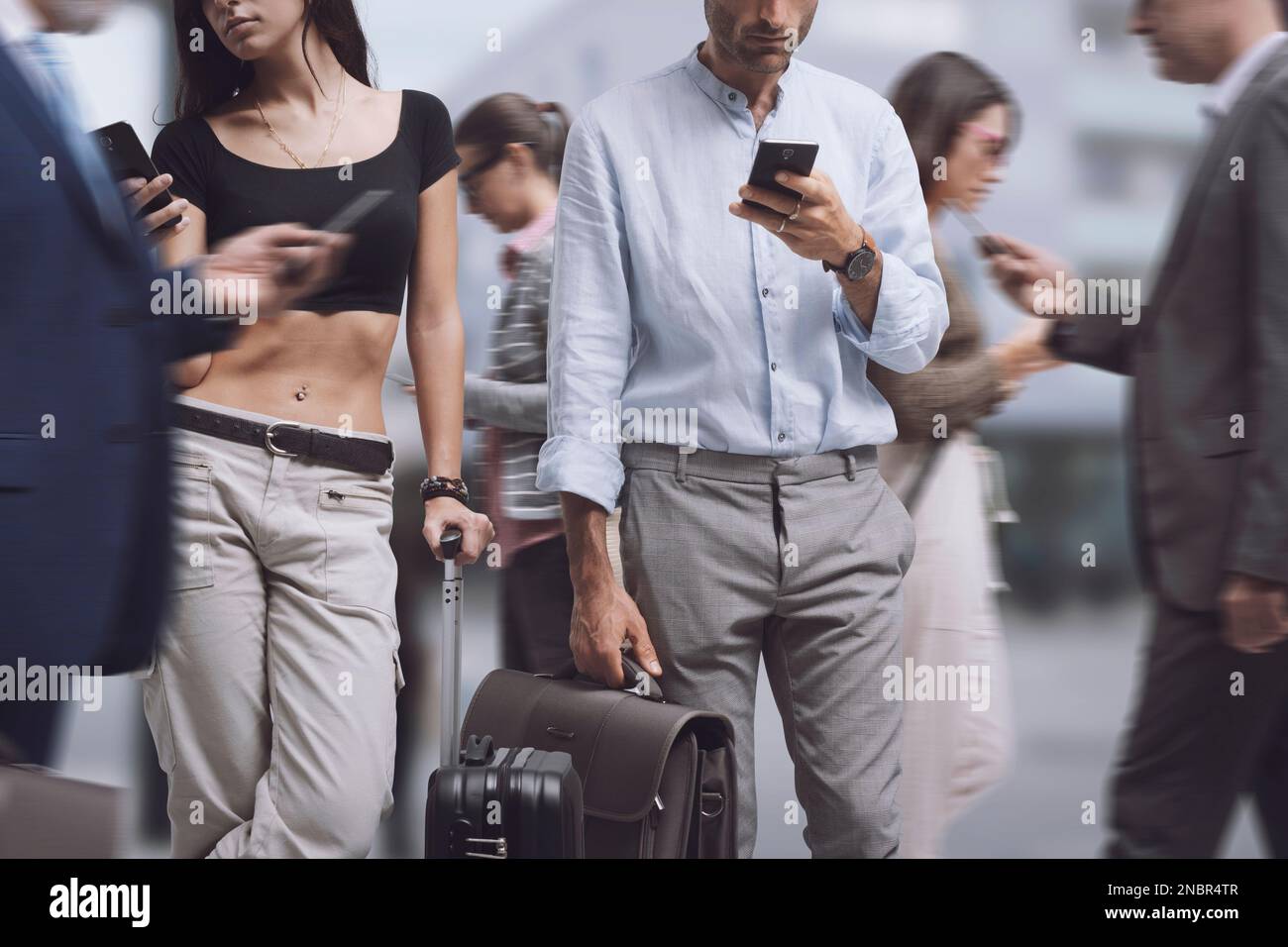 Crowd of distracted people walking in the city street and using ...