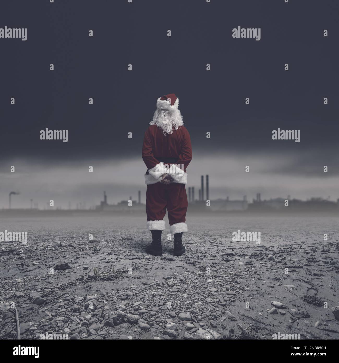 Hopeless lonely Santa Claus staring at the barren land and at the ...
