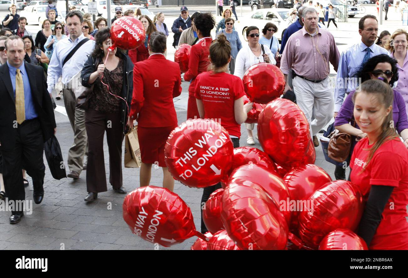Virgin Airways cabin crew hand out flyers and balloons as Virgin ...