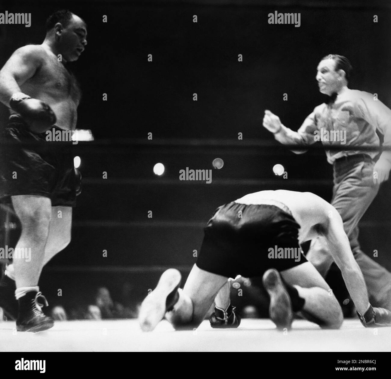 Nathan Mann, New Haven heavyweight, was unable to cope for long with ...