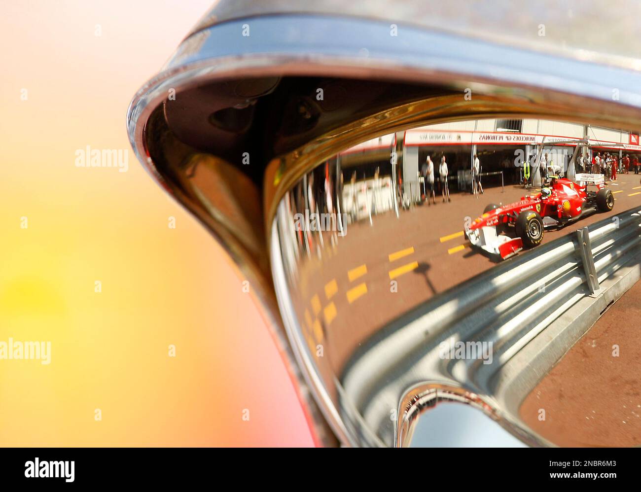 Ferrari Brazilian driver Felipe Massa is reflected in a firefighter ...
