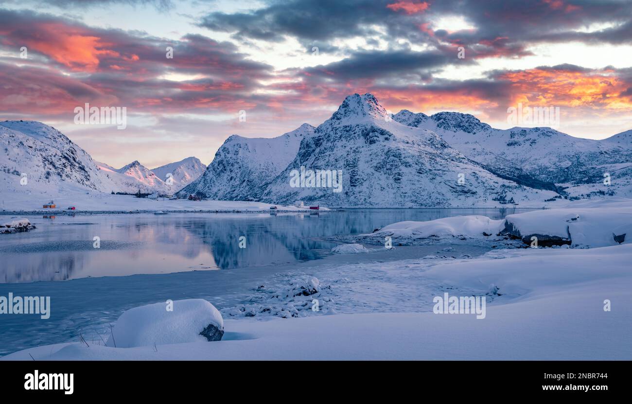 Astonishing winter sunrise over polar circle. Frozen Boosen fjord on ...