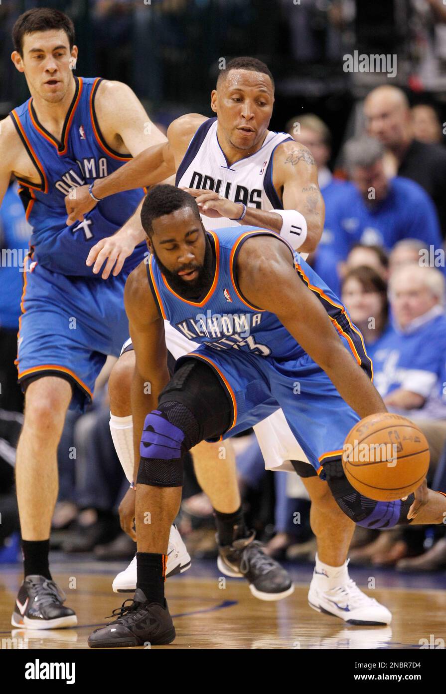 Oklahoma City Thunder guard James Harden (13) tries to keep control of ...