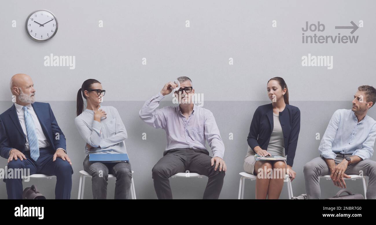 Anxious scared man sitting and waiting for a job interview, he is ...