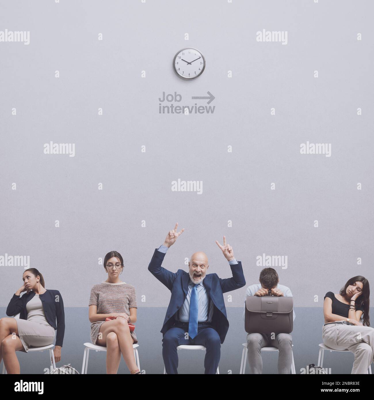 Happy man hired after the job interview, he is celebrating with arms ...