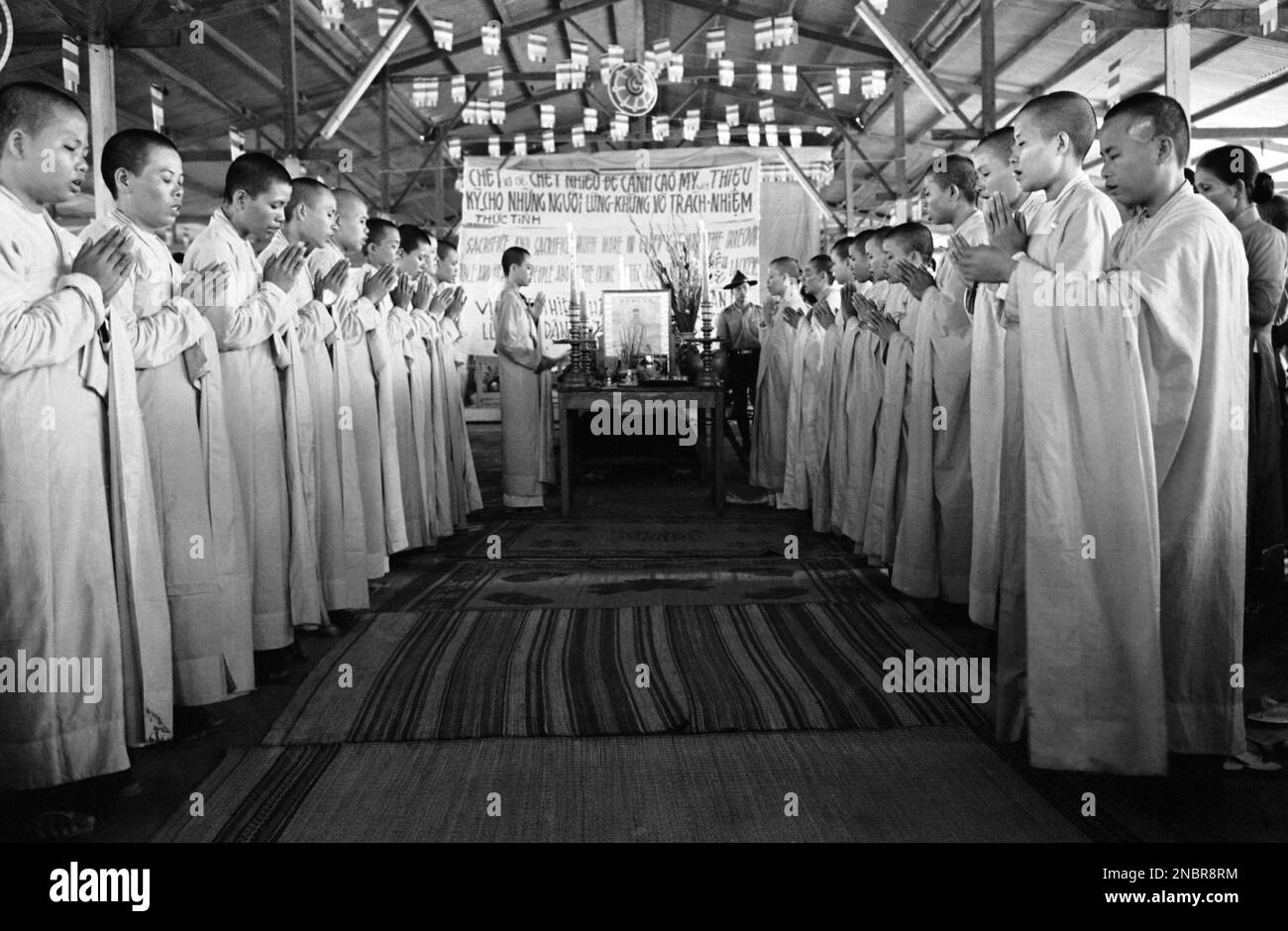Monks pray inside the main Vien Hoa Dao Pagoda in Saigon, May 31, 1966 ...