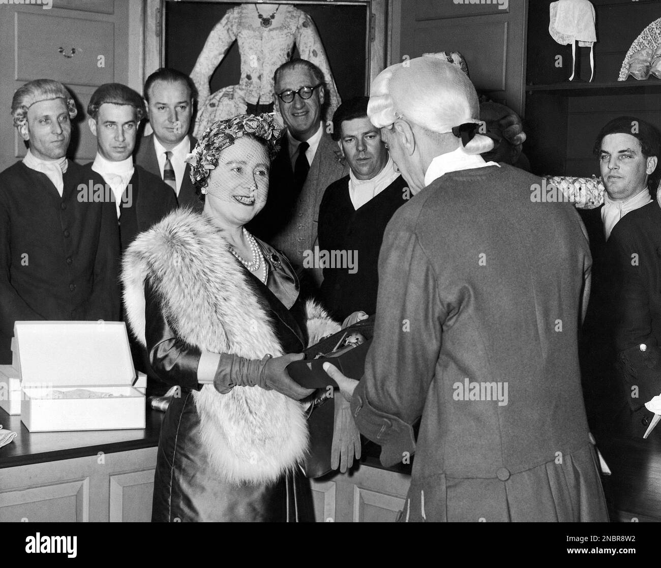 Queen Mother Elizabeth of England receives a silver tea set from ...