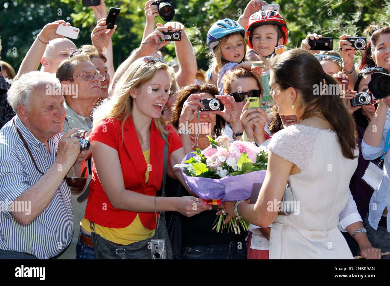 Sweden's Crown Princess Victoria is welcomed by spectators in front of ...