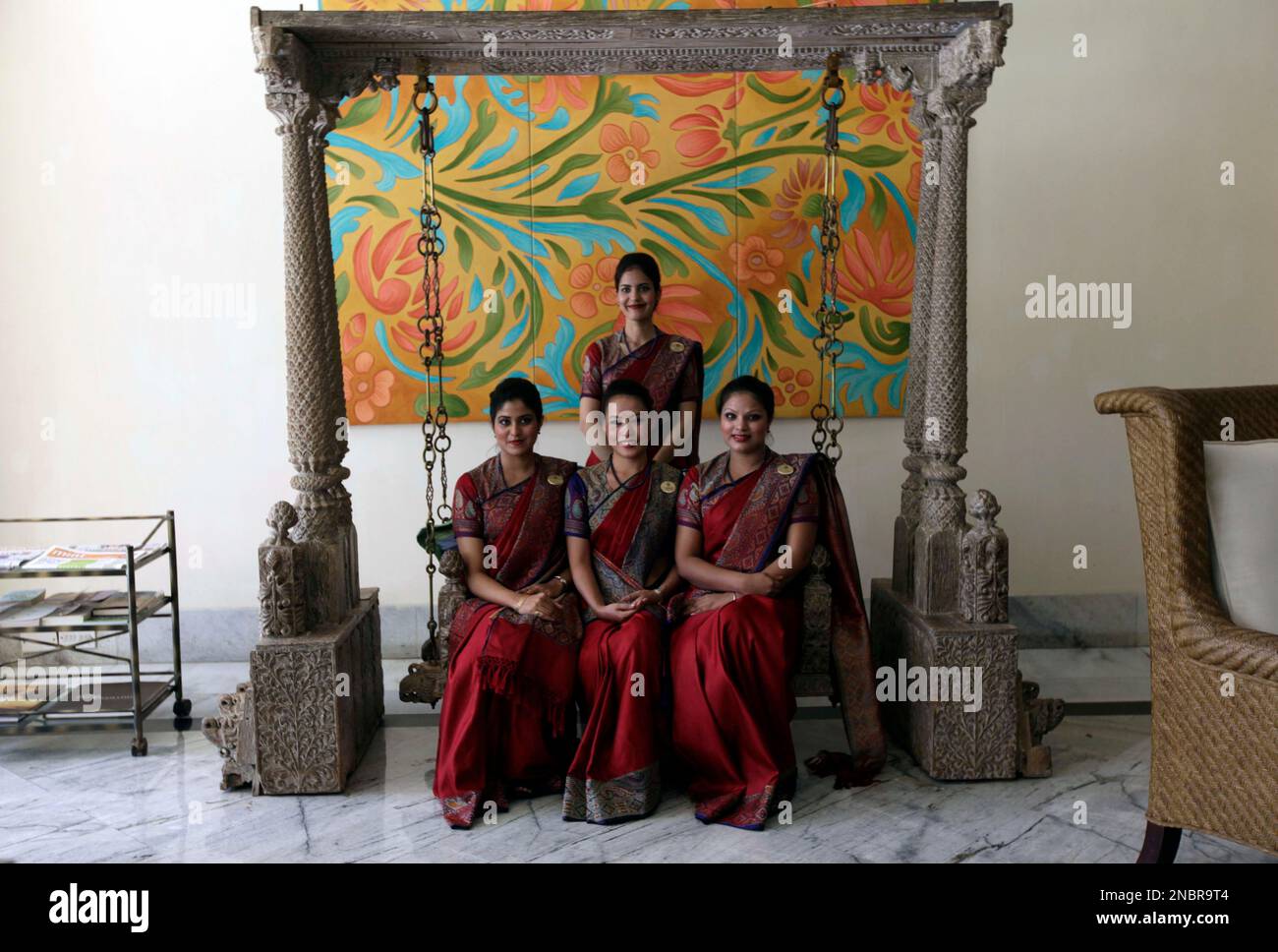 The staff of the Taj Mahal Palace Hotel pose for the media wearing ...