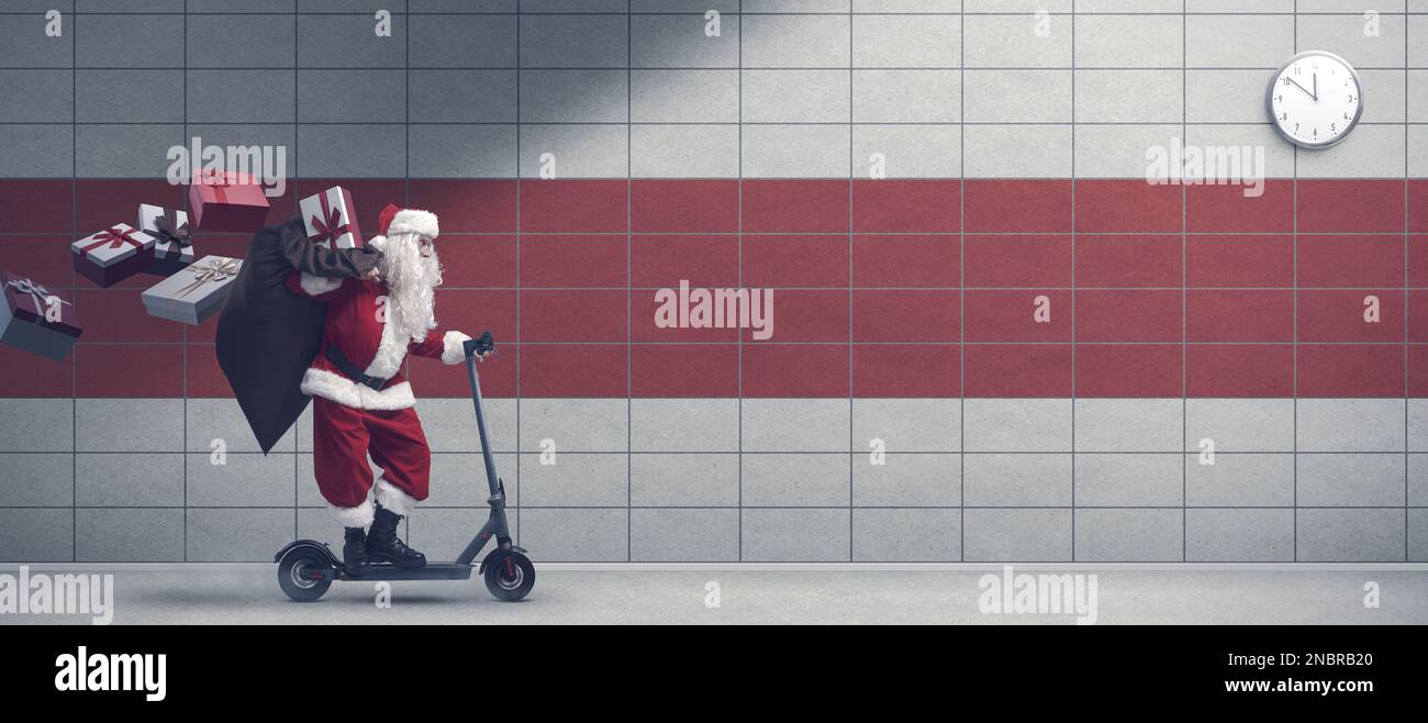 Fast Santa Claus delivering gifts on Christmas Eve, he is riding an eco ...