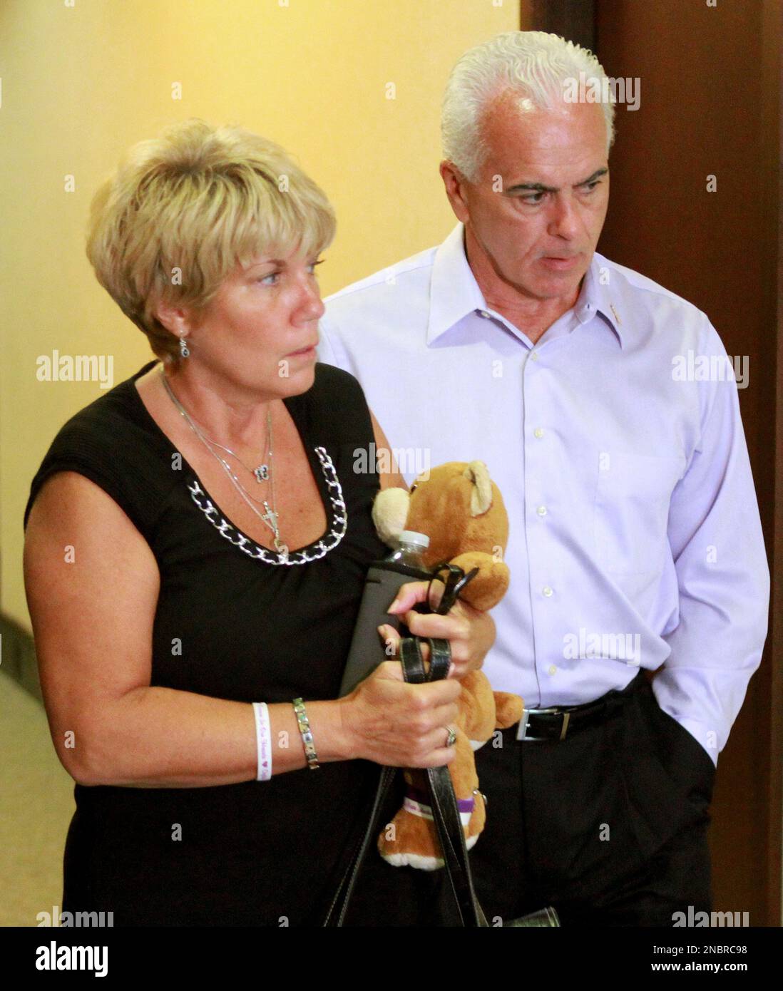 Cindy Anthony, holding a teddy bear, and her husband, George Anthony ...