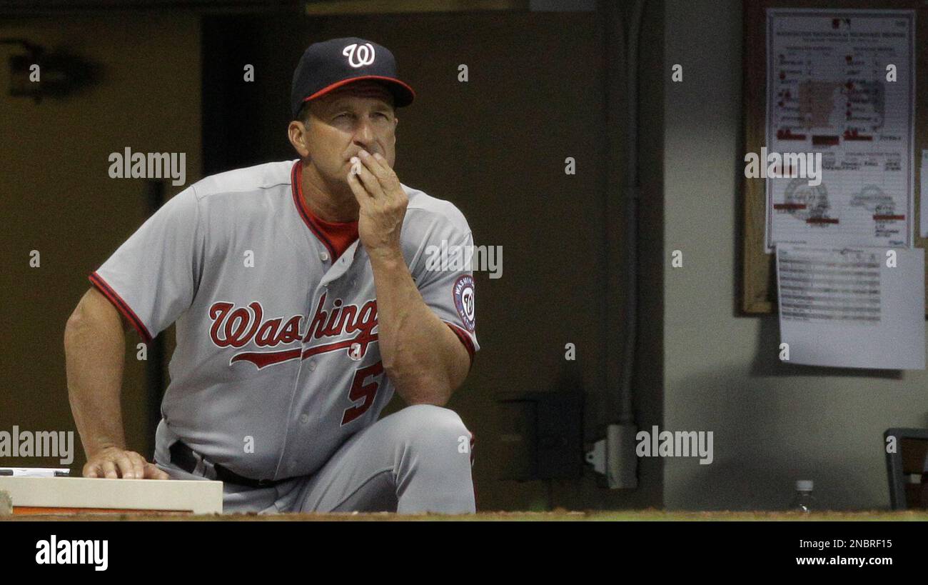 Washington Nationals manager Jim Riggleman watches from the dugout ...