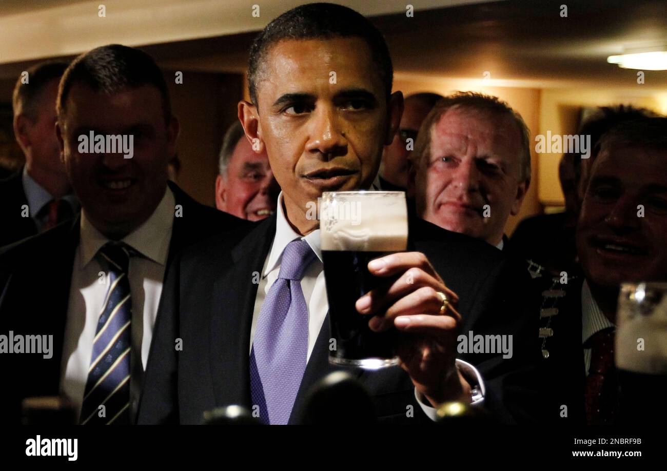 U.S. President Barack Obama drinks a Guinness beer as he meets with ...