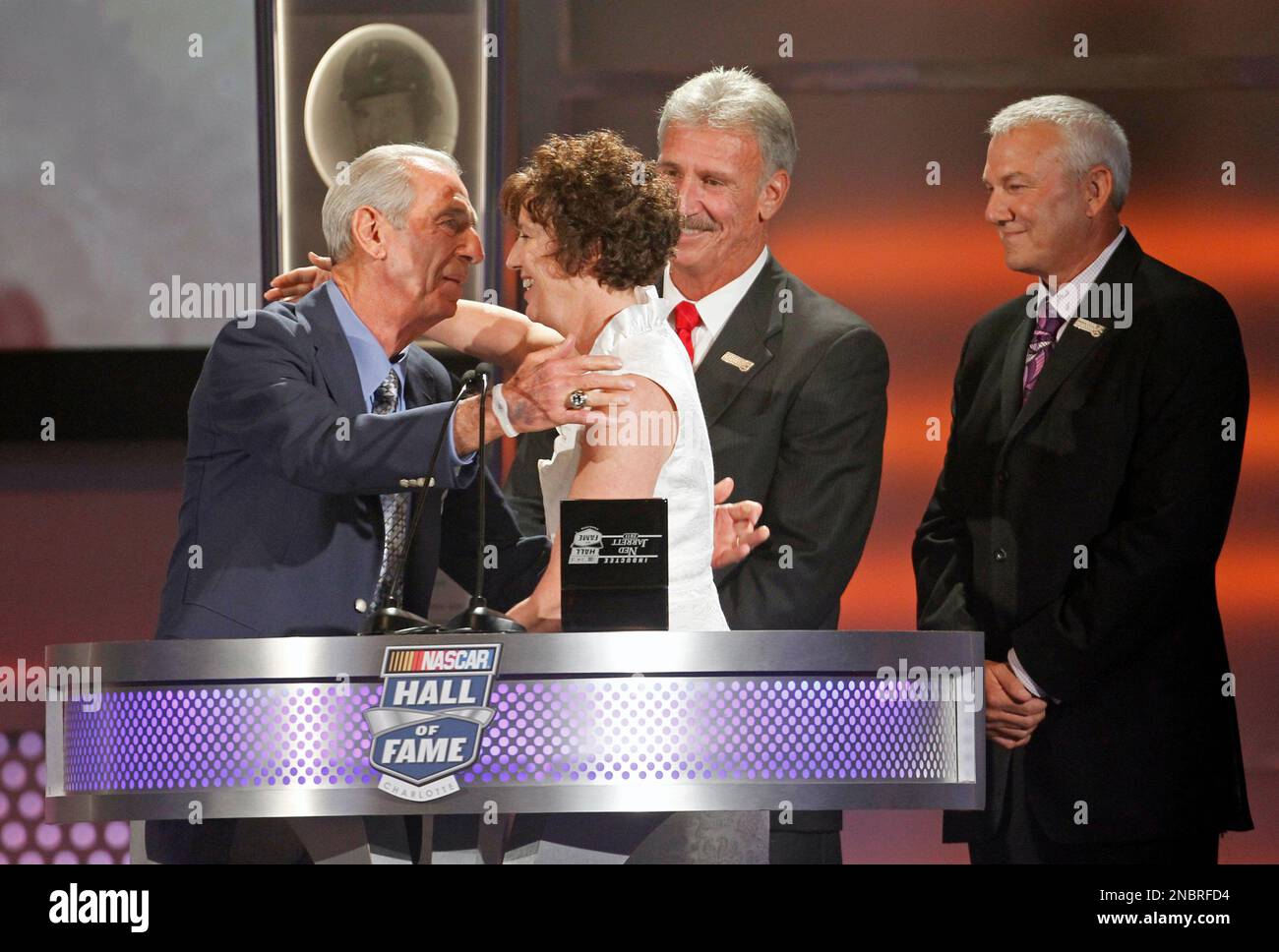 Ned Jarrett, left, embraces his daughter, Patti Makar, as sons Dale ...