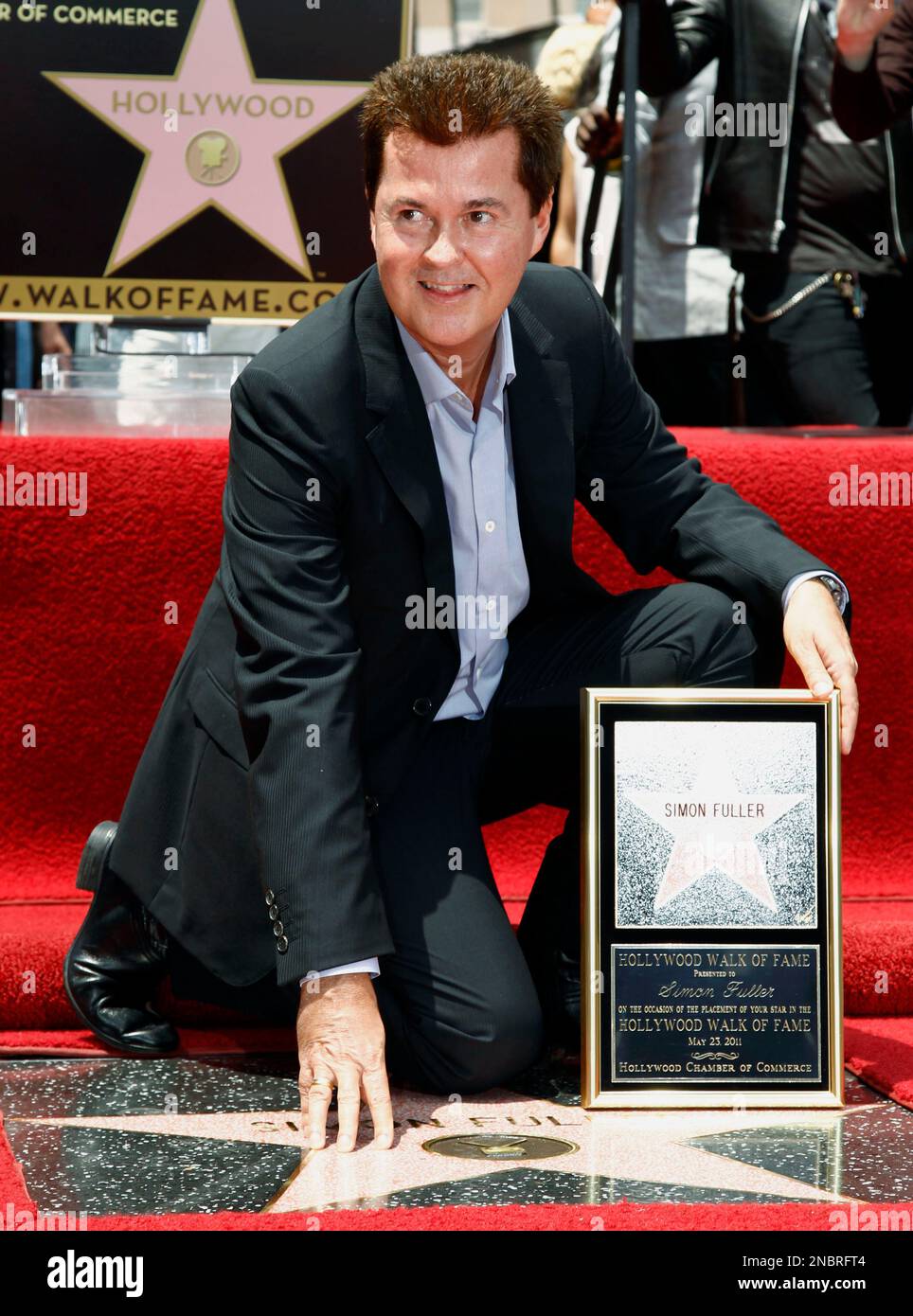 Entertainment producer Simon Fuller poses for photographers after ...