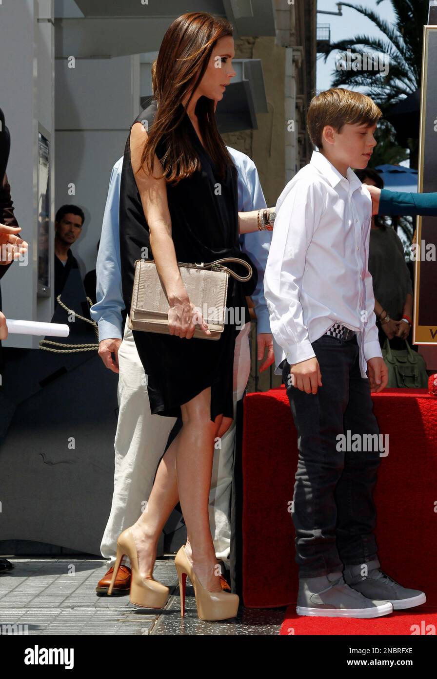 Victoria Beckham, left, and Brooklyn Beckham are seen during the ...