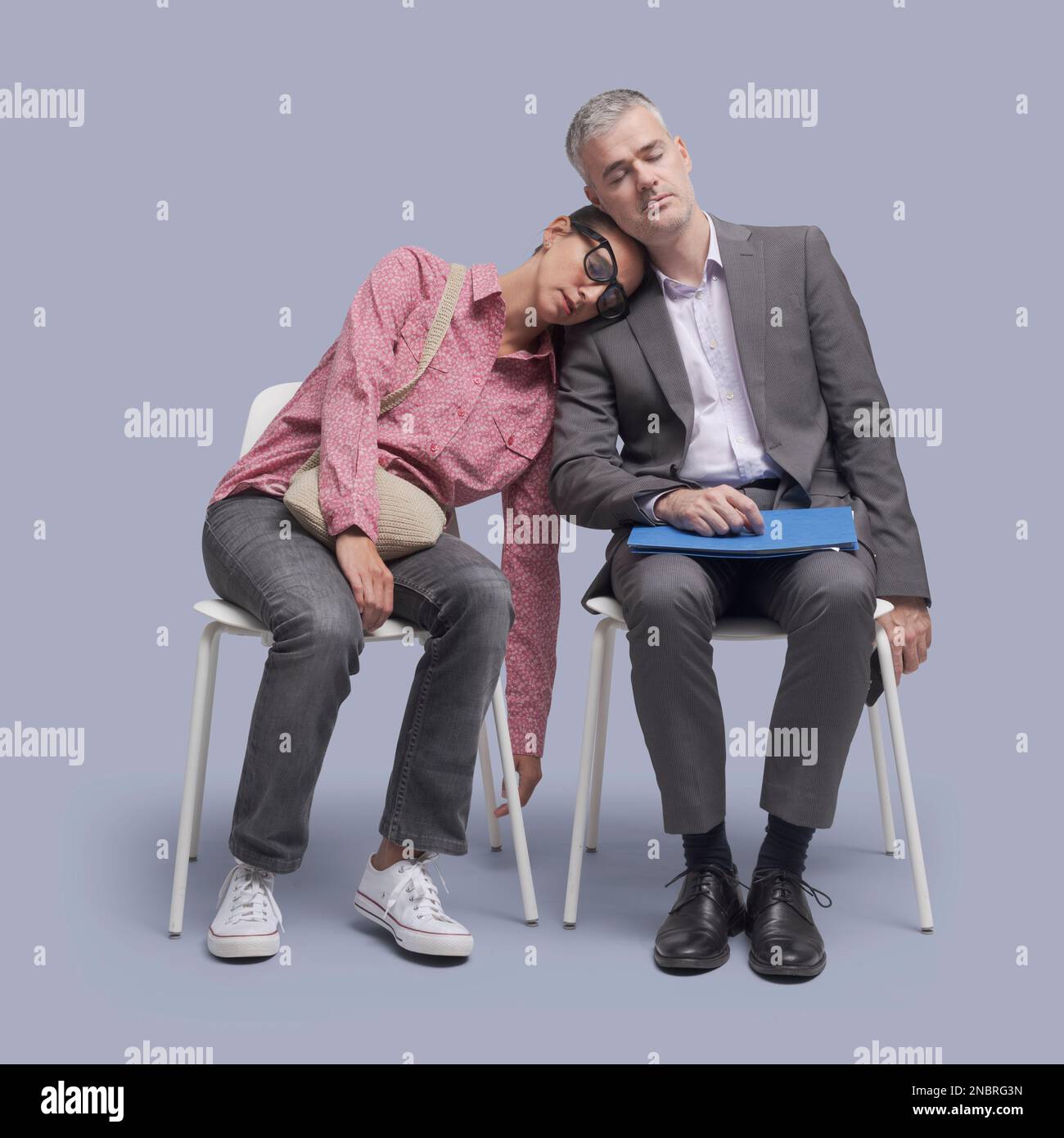 Two people sitting in the waiting room, they are tired and they fall ...