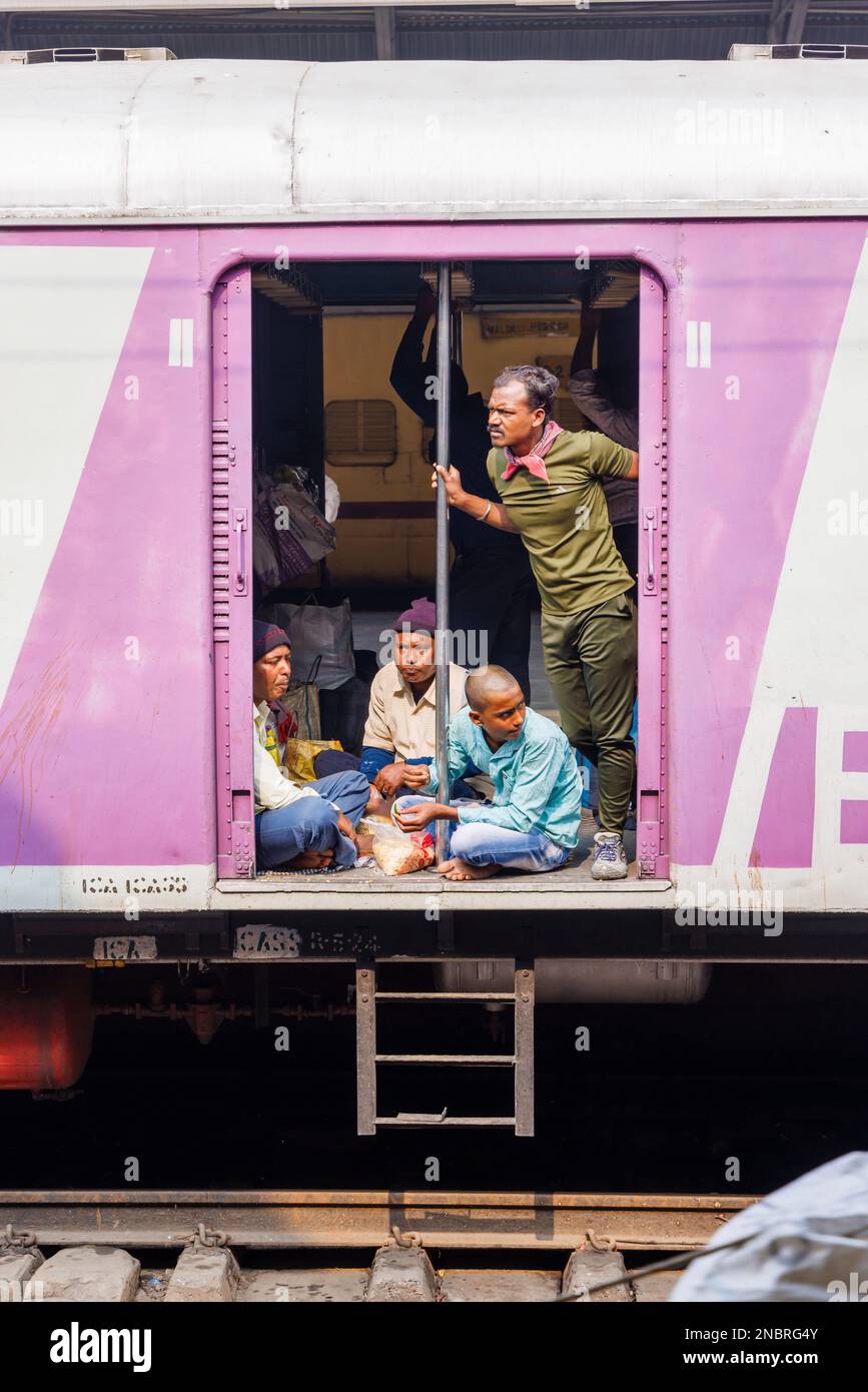 Passengers in an open doorway of a train railway carriage waiting to ...